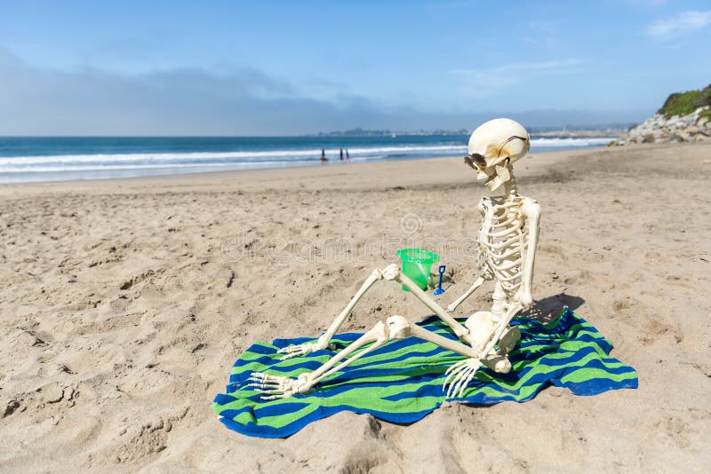 Skeleton Playing in the Sand on the Coast Stock Photo - Image of shovel ...