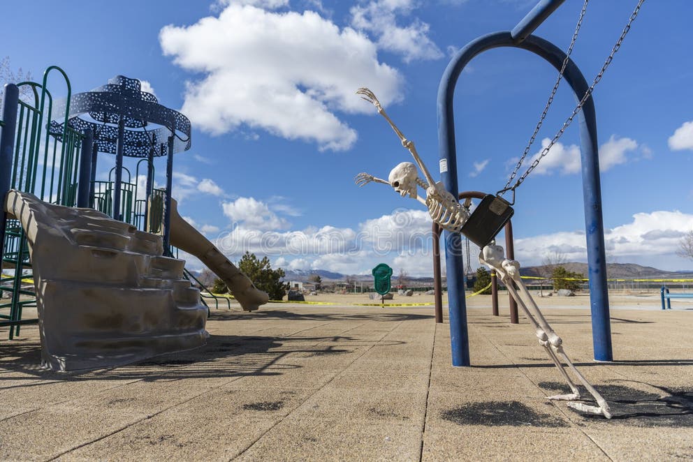 Skeleton Playing Superman on a Child S Swing in an Empty Park Stock ...