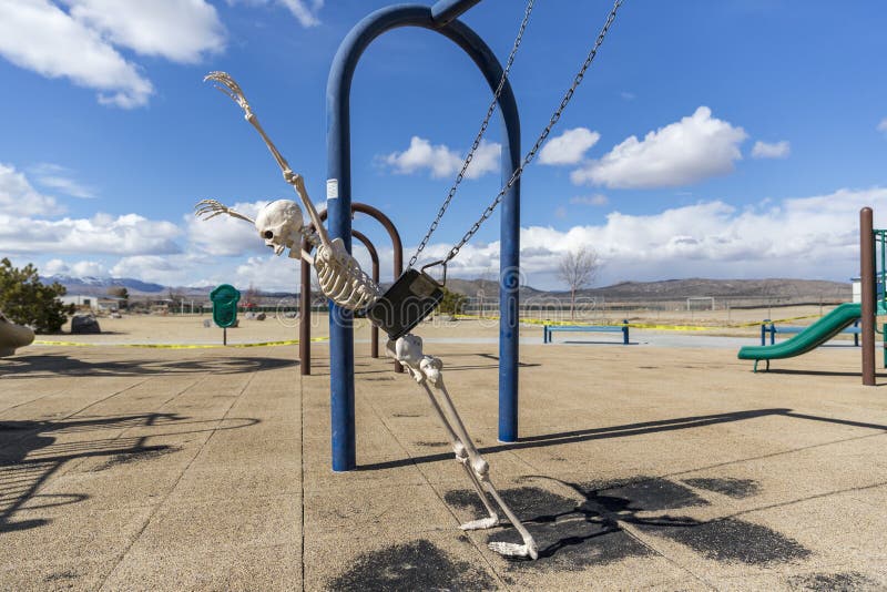 Skeleton Playing Superman on a Child S Swing in an Empty Park Stock ...