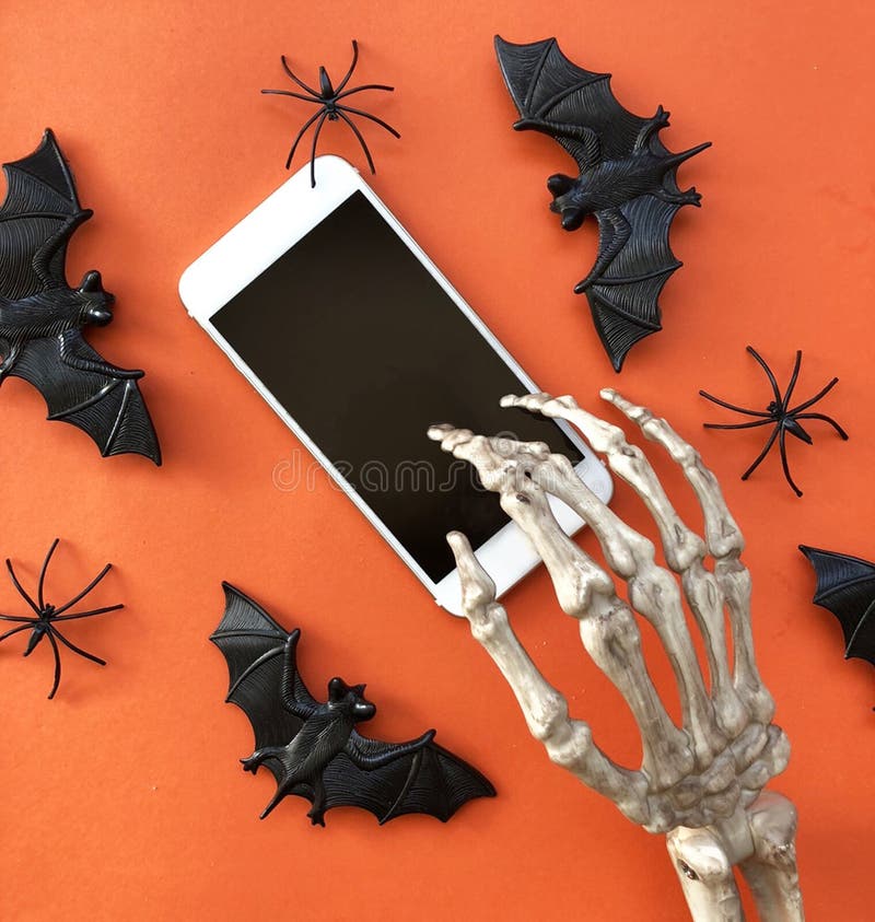 Skeleton with a smartphone stock photo. Image of halloween - 75376734