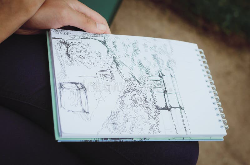 A Sketch of a Drawing in a Notebook, Drawing on the Street Editorial ...
