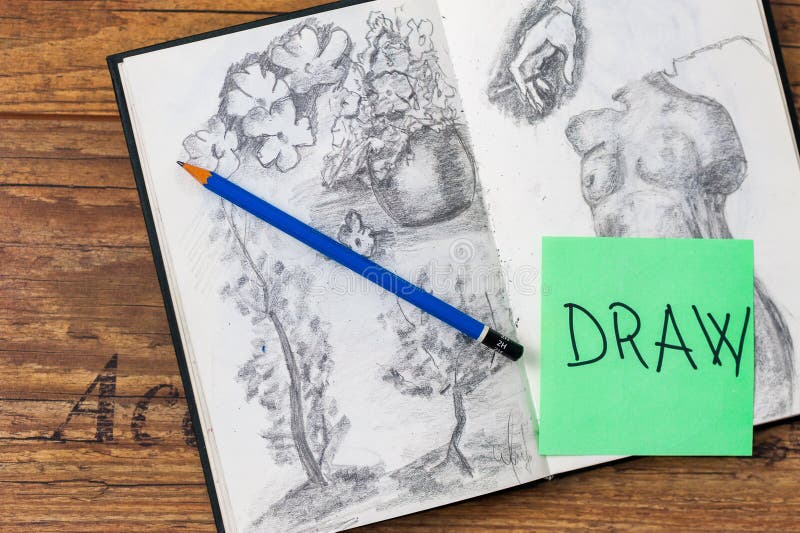 Sketchbook with Pencil and Drawings and Draw Text Written on Post it ...