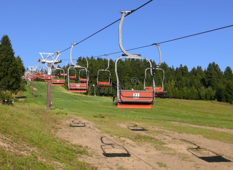 Chair ski lift with skiers stock photo. Image of carry - 17782676