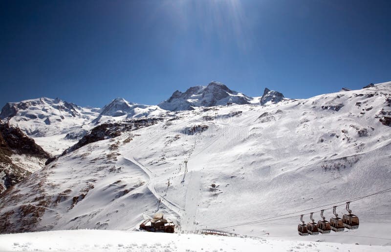Ski Chair Lift in Swiss Alps Stock Photo - Image of blue, freezing: 4761362
