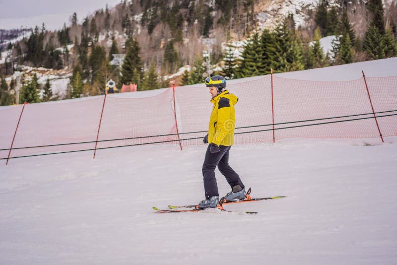 Ski Instructor at Training Track Showing Students How To Ski Stock ...