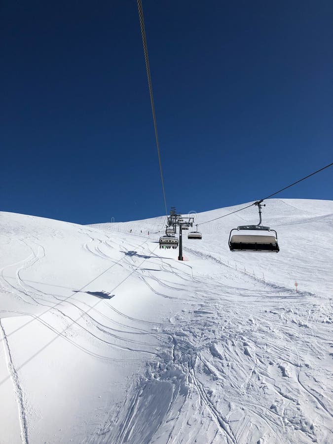 Ski lift above slope stock image. Image of active, rocky - 155537407