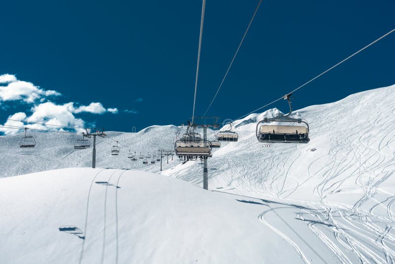 Ski lift cables and seats stock photo. Image of leisure - 100653538