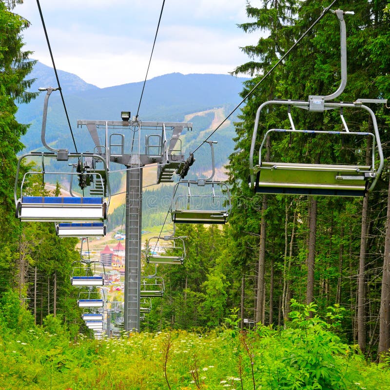 Ski lift in the mountains stock image. Image of resort - 69310551