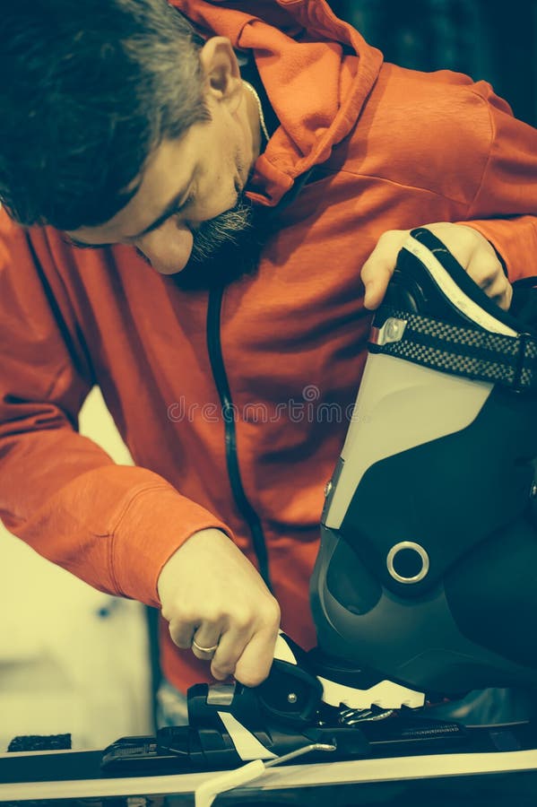 Ski Repair Shop Worker Adjust the Bindings Stock Image - Image of ...