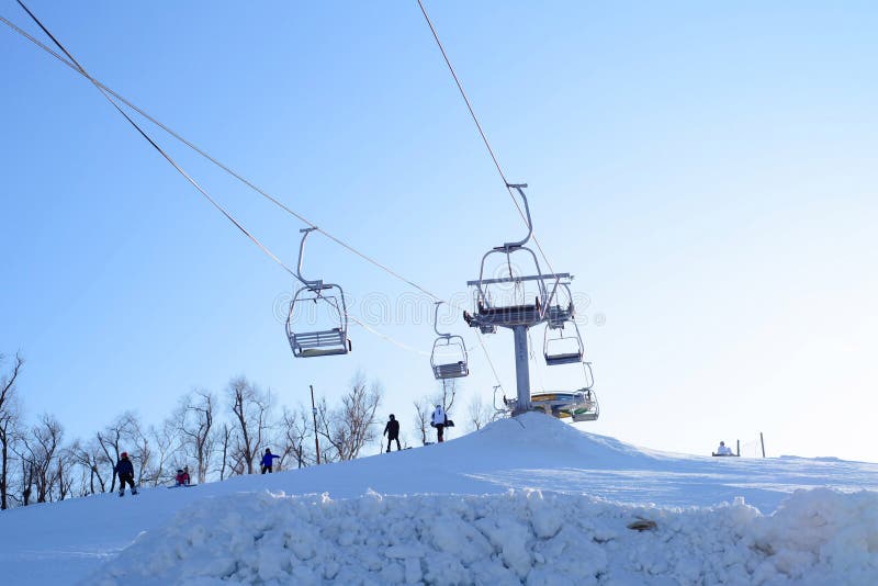 Ski Resort with Ski Lift Against Blue Sky in Winter Stock Photo - Image ...