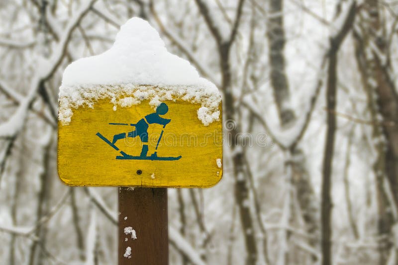 Snow-covered Yellow Sign with a Skier on the Ski Track Stock Photo ...