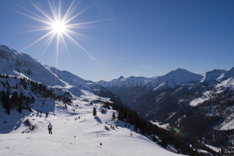 Ski slope in austrian alps stock image. Image of tourist - 17992883