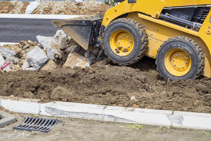 Skid Loader or Bobcat Working Stock Photo - Image of bulldoze, city ...
