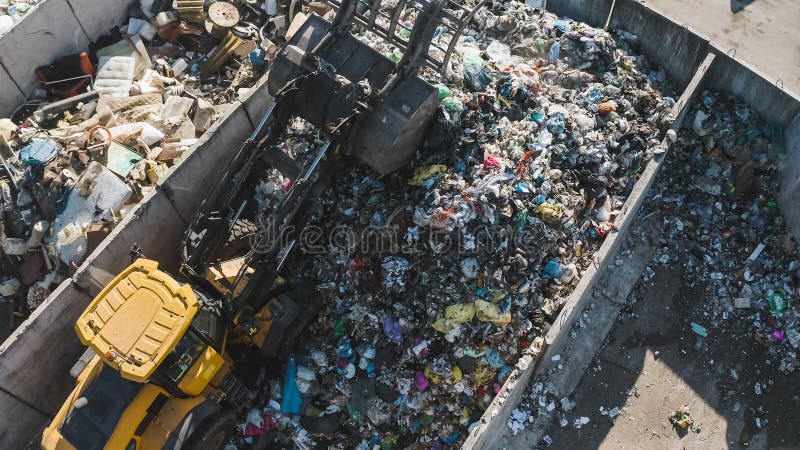 Skid Loader Scooping, Lifting, and Dumping Garbage, Top Down Aerial ...
