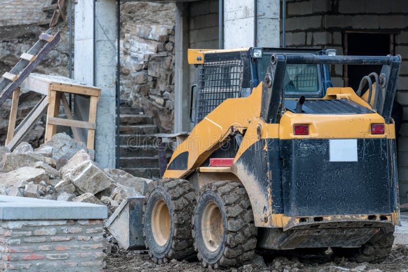 Skid Loader Working on Building Construction Stock Image - Image of ...