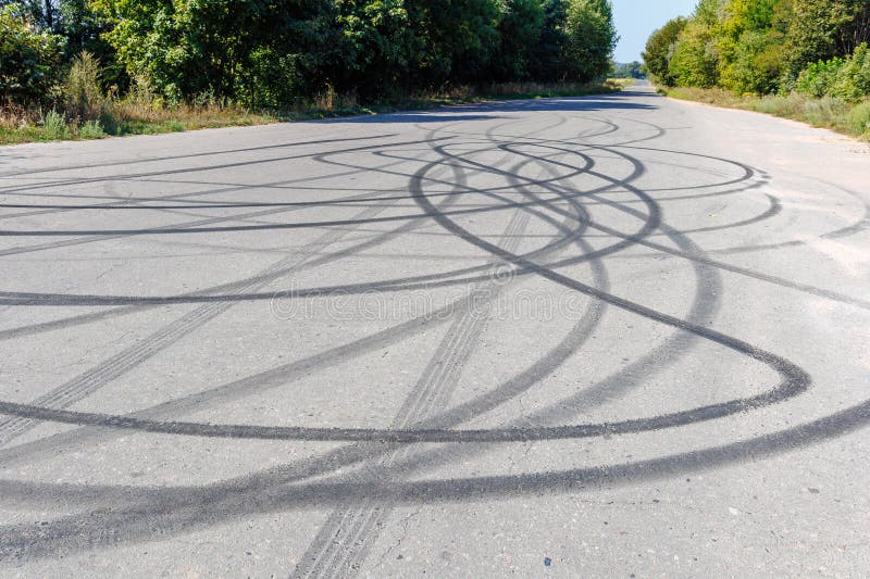 Skid Marks on a Road Surface. Circular Tire Marks Left by Drivers Doing ...
