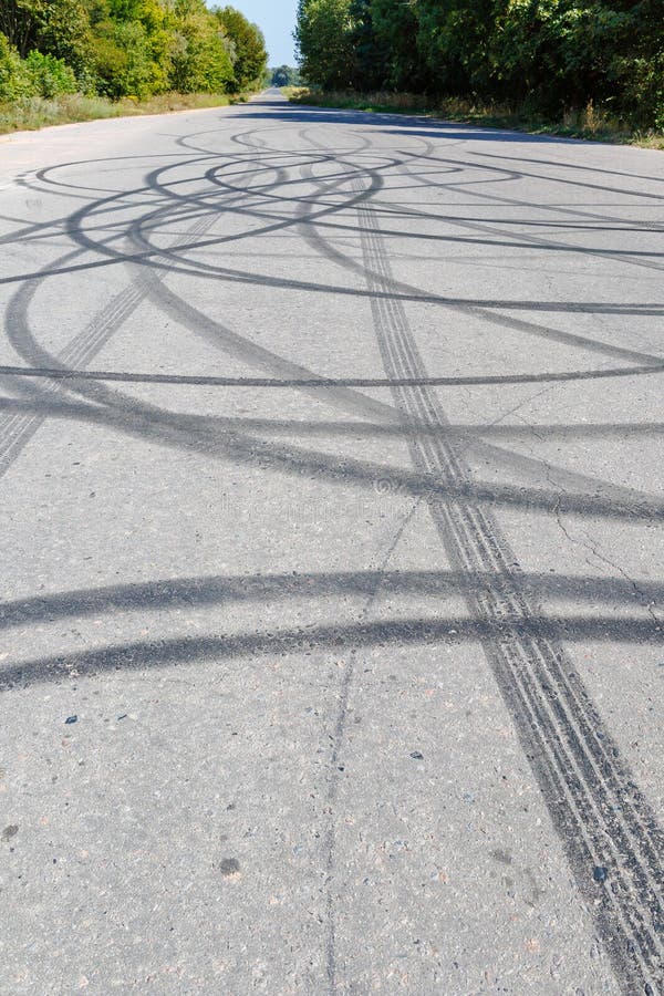 Skid Marks on a Road Surface. Circular Tire Marks Left by Drivers Doing ...