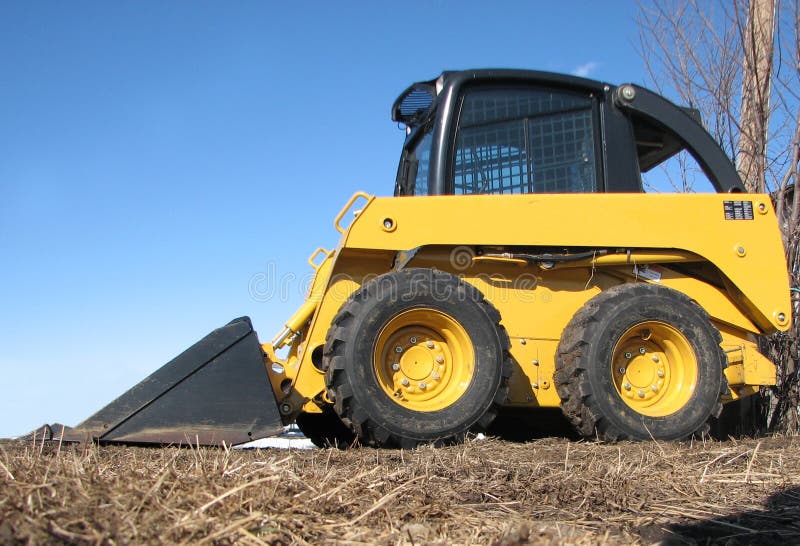 Yellow Bobcat Machine Logo