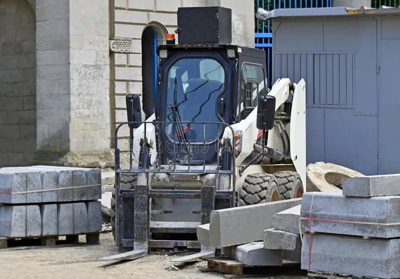 Skid steer forklift loader stock image. Image of lifting - 316552339