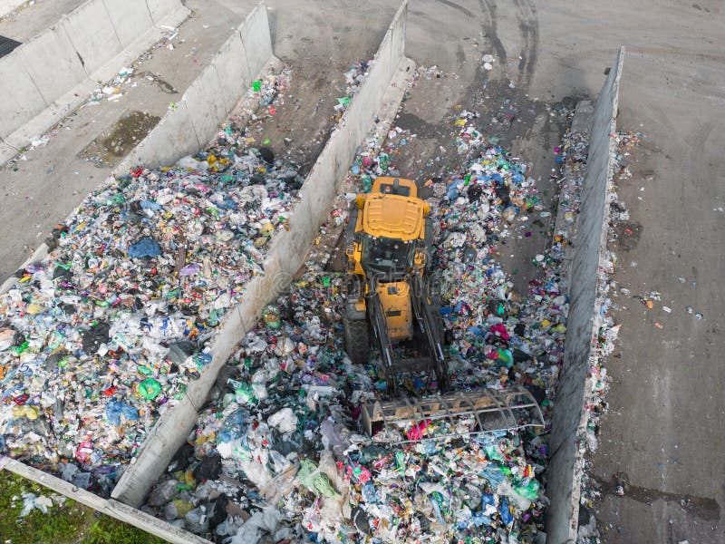 Skid Steer Loader Moving Garbage at the Landfill Site, Drone Shot Stock ...