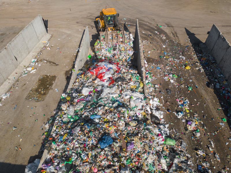 Skid Steer Loader Moving Garbage at the Landfill Site, Drone Shot Stock ...