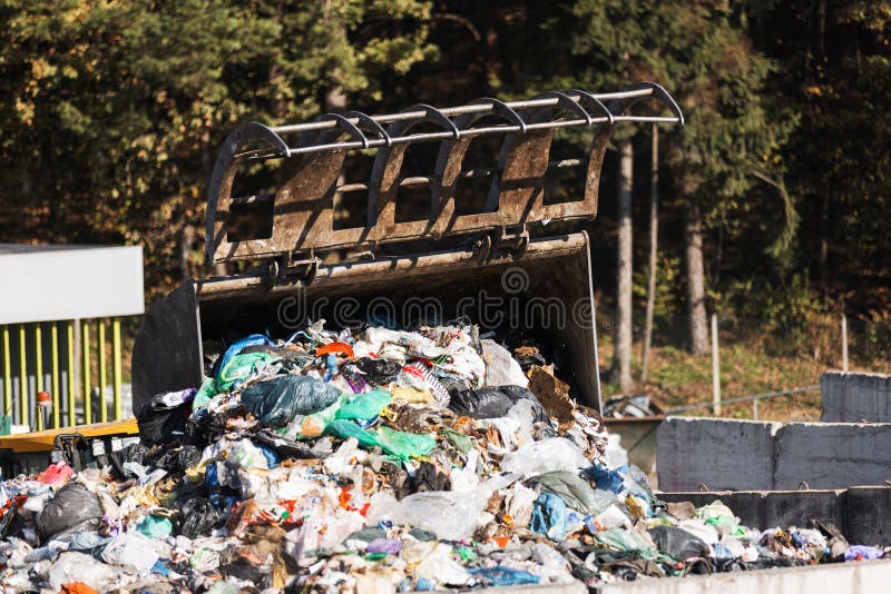Moving a Pile of Waste with a Wheel Loader at the Landfill, Aerial View ...