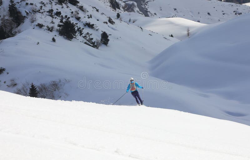 Skier Going Off-piste on White Snow in the Mountains with the Risk of ...
