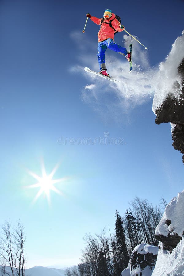 Skier Jumping Against Blue Sky Stock Photo - Image of alive, excitemant ...