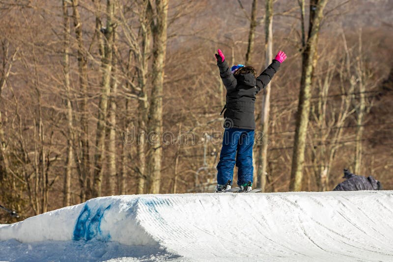 Skier Jumping and Having Fun at Resork in Winter Form the Back Stock ...