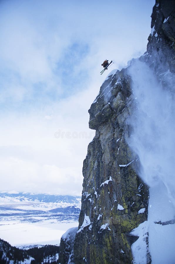 Skier Jumping from Mountain Cliff Stock Photo - Image of hobby, cloud ...