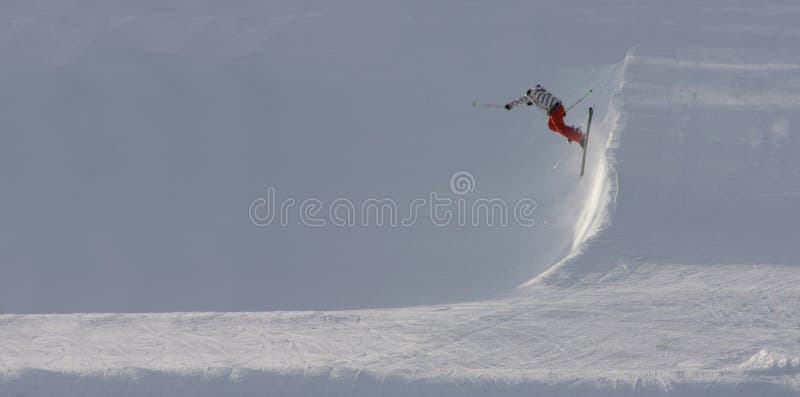 Skier Jumping Off Steep Slope Stock Image - Image of jumping, skiing ...