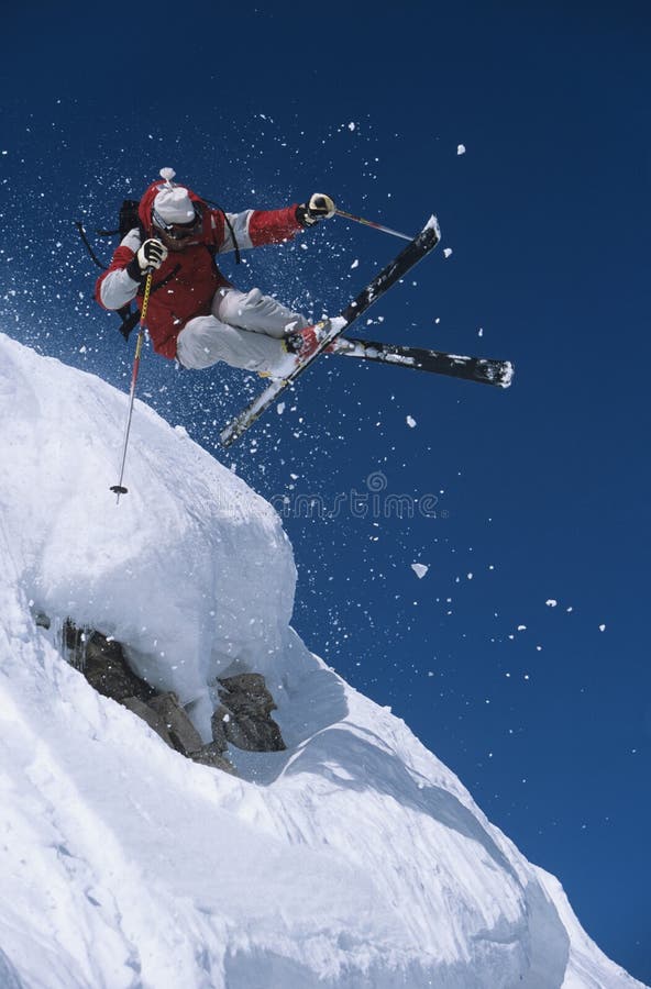 Skier in Midair Above Snow on Ski Slope Stock Image - Image of sport ...