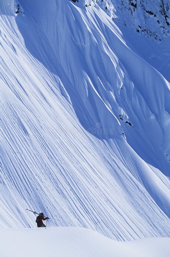 Skier on Mountain Slope stock image. Image of hobbies - 31837403