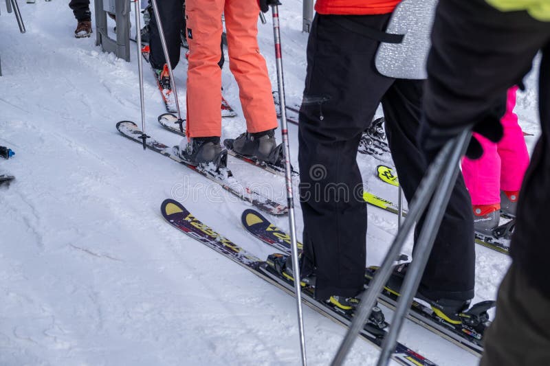 Skiers in Line at a Snowy Ski Resort Stock Image - Image of skiers ...