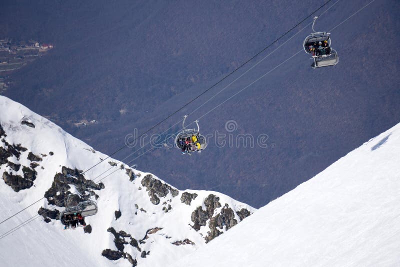 Skiers and Snowboarders on a Ski Lift Stock Photo - Image of equipment ...
