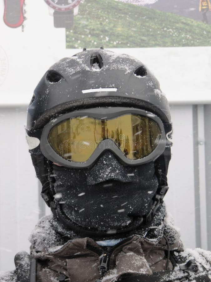 Skiier with Face Completely Covered Wearing a Helmet and Goggles Stock ...