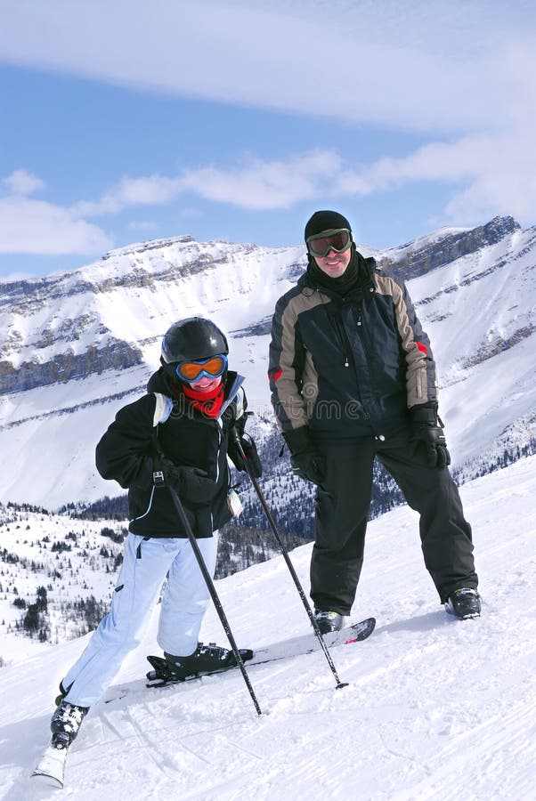 Family Enjoying a Day Skiing Together Stock Image - Image of nature ...