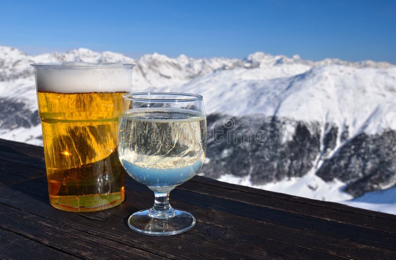 Skiing Resort. Glasses of Beer and a Ski Helmet. Stock Photo - Image of ...