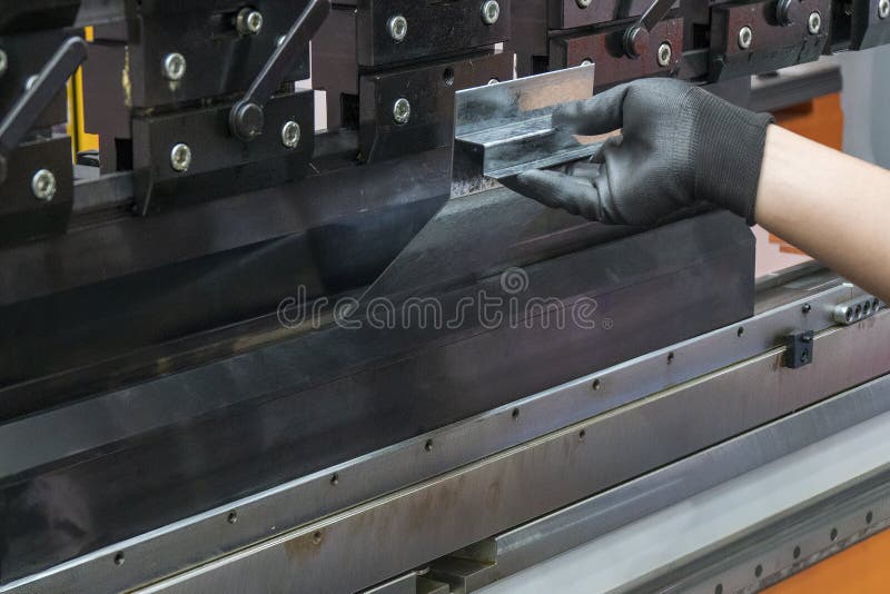 The Skill Operator Working with Hydraulic Press Brake Bending Machine ...