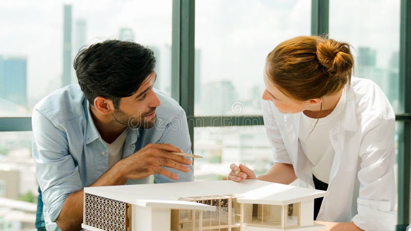 Skilled Architect Team Discussion about House Model Construction ...