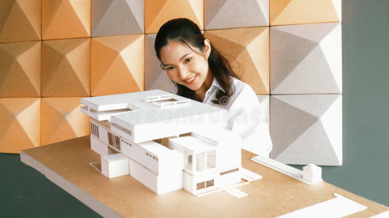 Skilled Architect Holds Architect Model while Check Mistake Point ...