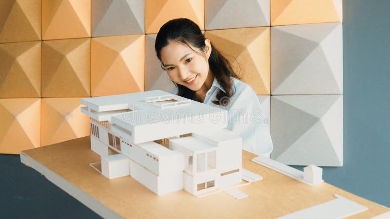 Skilled Architect Holds Architect Model while Check Mistake Point ...