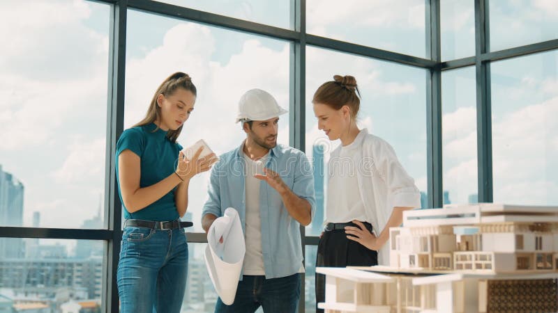 Skilled Architect Team Discuss about Project while Taking a Note ...