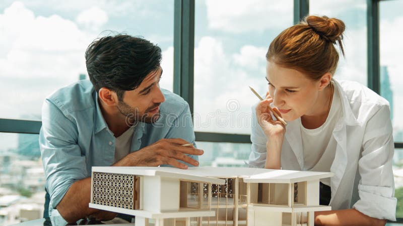 Skilled Architect Team Discussion about House Model Construction ...
