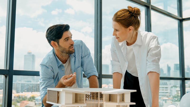Skilled Architect Team Discussion about House Model Construction ...