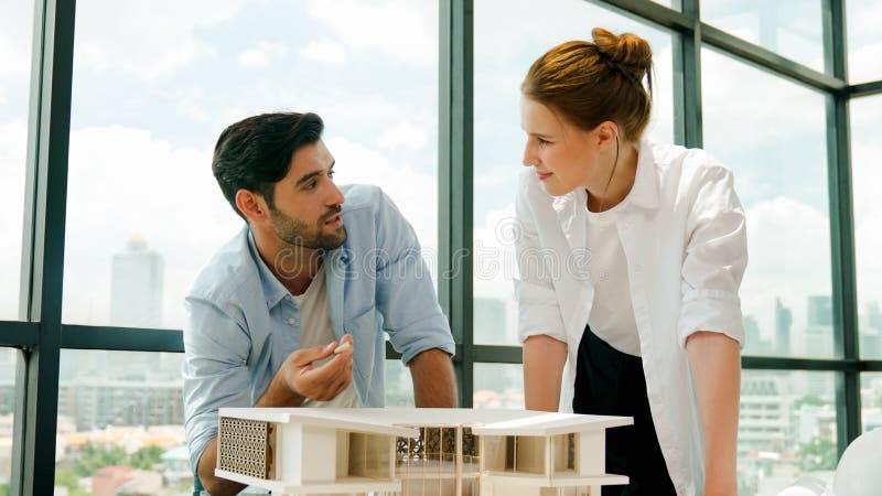 Skilled Architect Team Discussion about House Model Construction ...