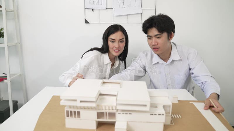 Skilled Architecture Engineer Team Measure and Decide House Model. Immaculate. Stock Video ...