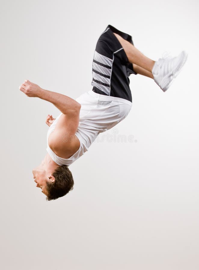 Skilled Athlete Doing Somersault in Mid-air Stock Photo - Image of luck ...