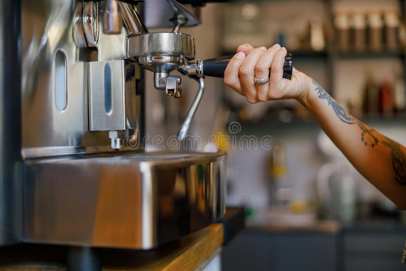 A Skilled Barista is Preparing a Rich Espresso Using a Highquality ...