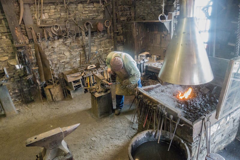 A Skilled Blacksmith Working in His Traditional Workshop Editorial ...